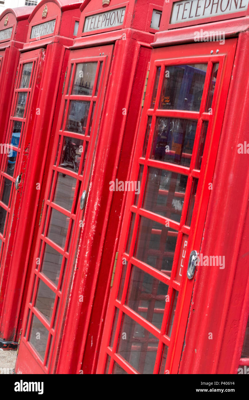 a row of traditional red gpo telephone boxes or callboxed in central ...