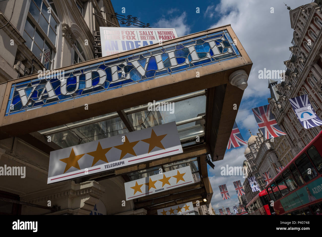 the vaudeville theatre in the strand, central London beneath blue sky ...
