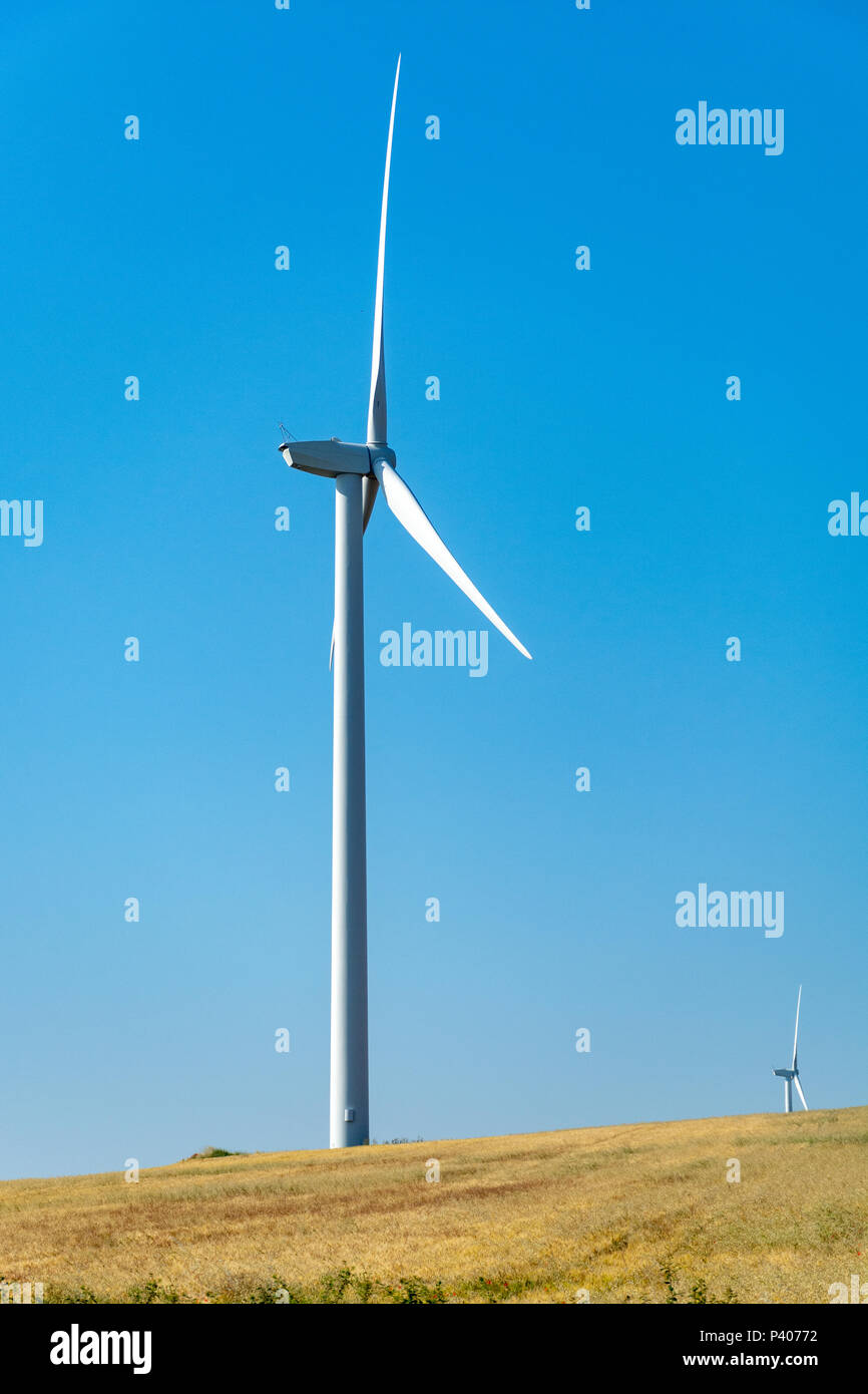 Modern wind farm with big wind turbines towers, source for renewable ...