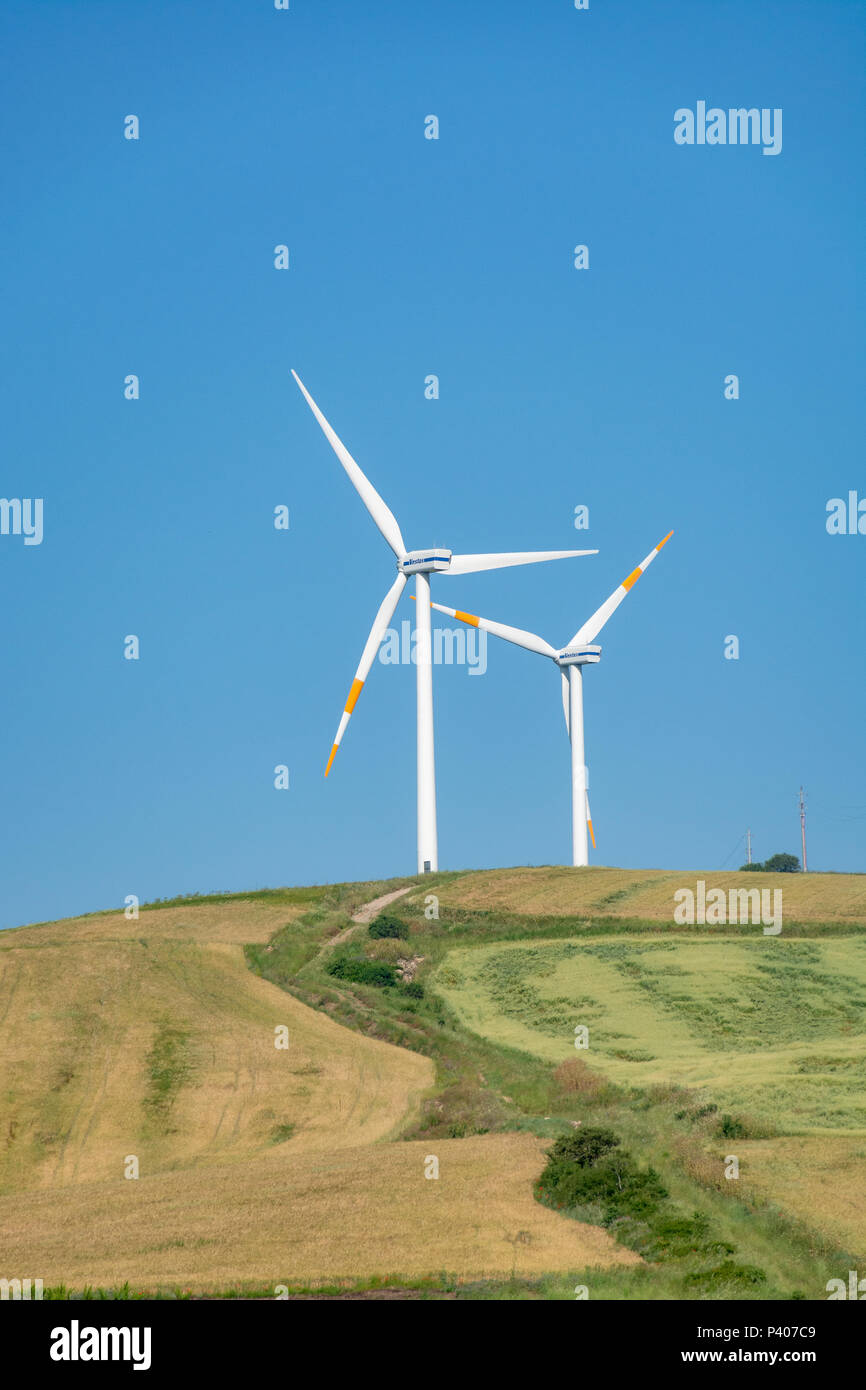 Modern wind farm with big wind turbines towers, source for renewable ...