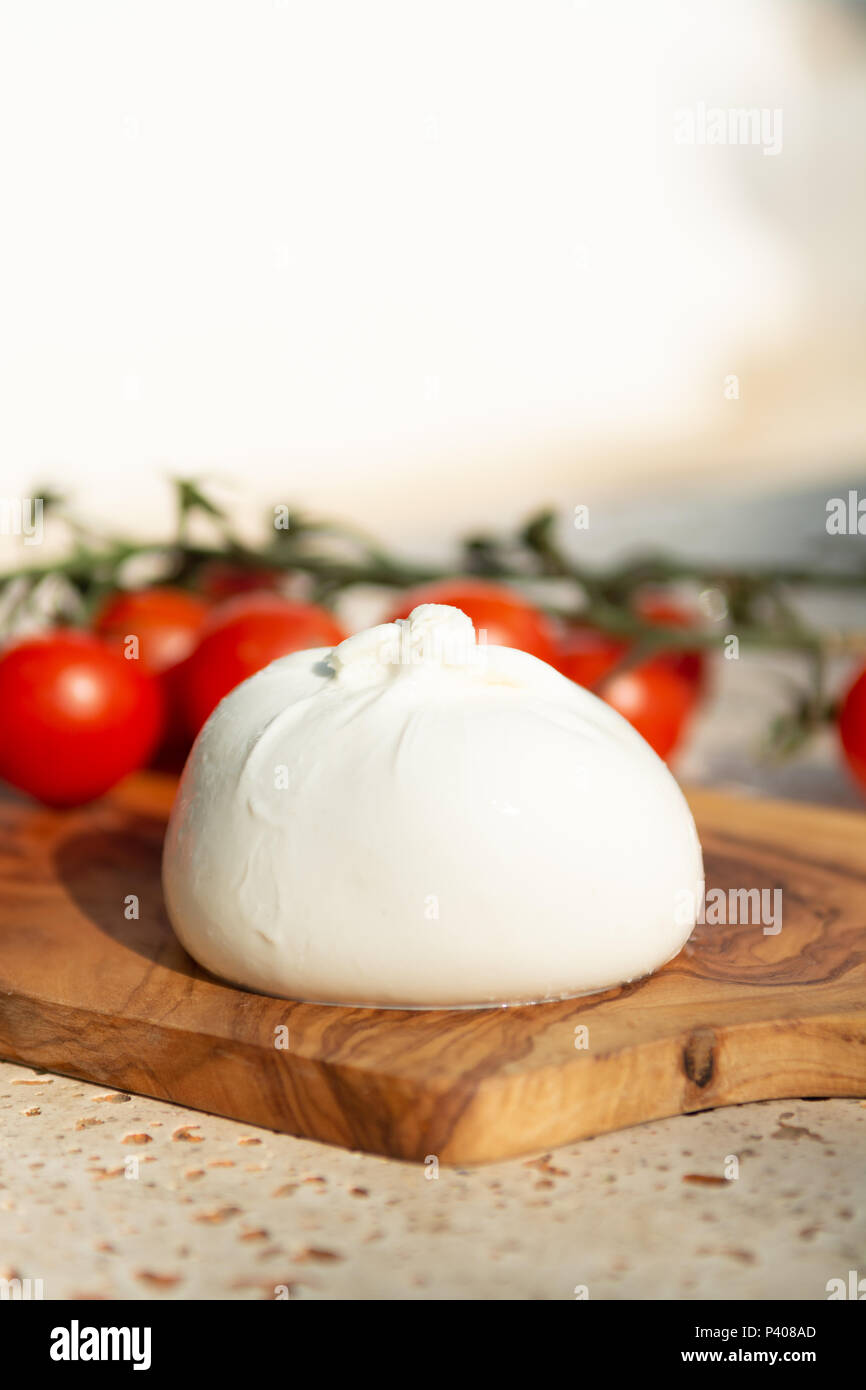 Fresh soft white burrata, buttery cheese, made from a mix of mozzarella ...