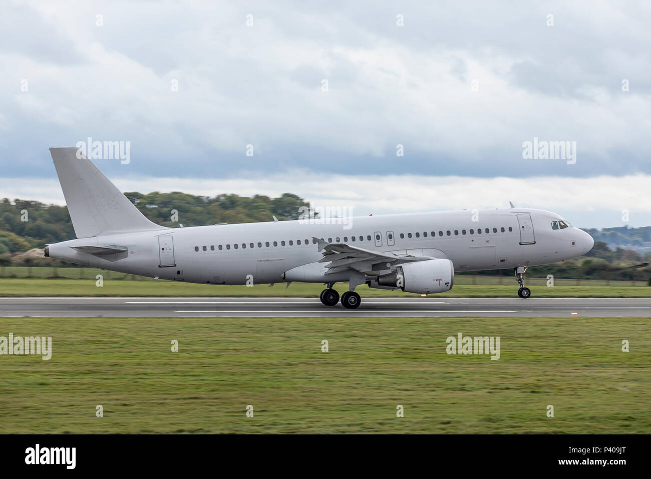 An Airbus A320 commercial airliner with blank livery taking off Stock ...
