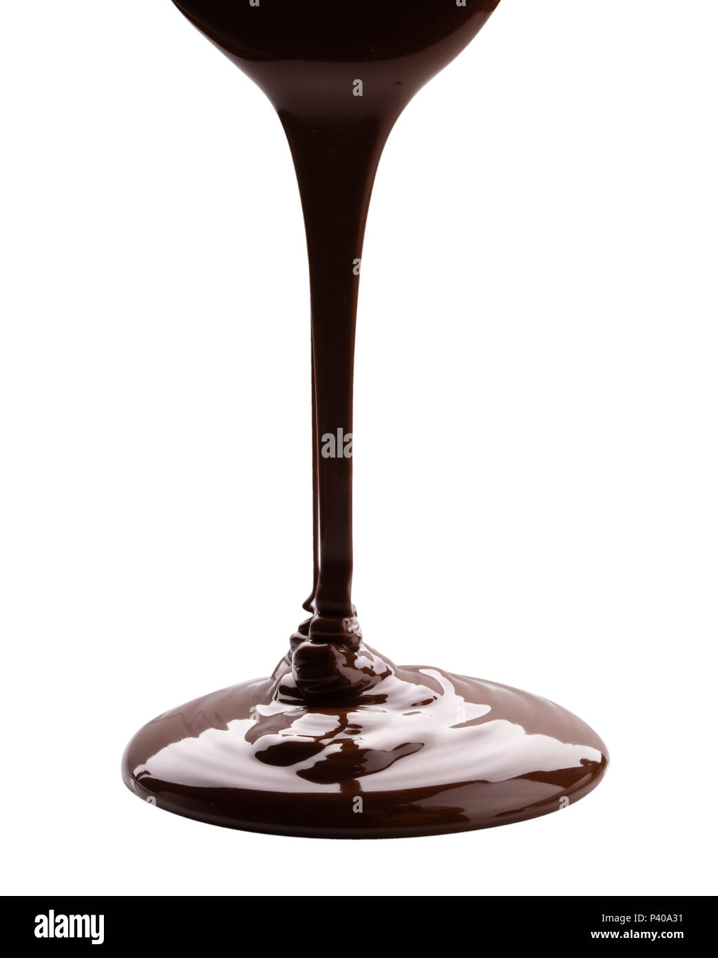 Melted chocolate flowing. Isolated on white background Stock Photo - Alamy