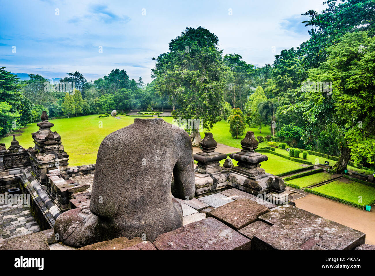 headless Buddha statues at a ballustrade of the 9th century Borobudur ...