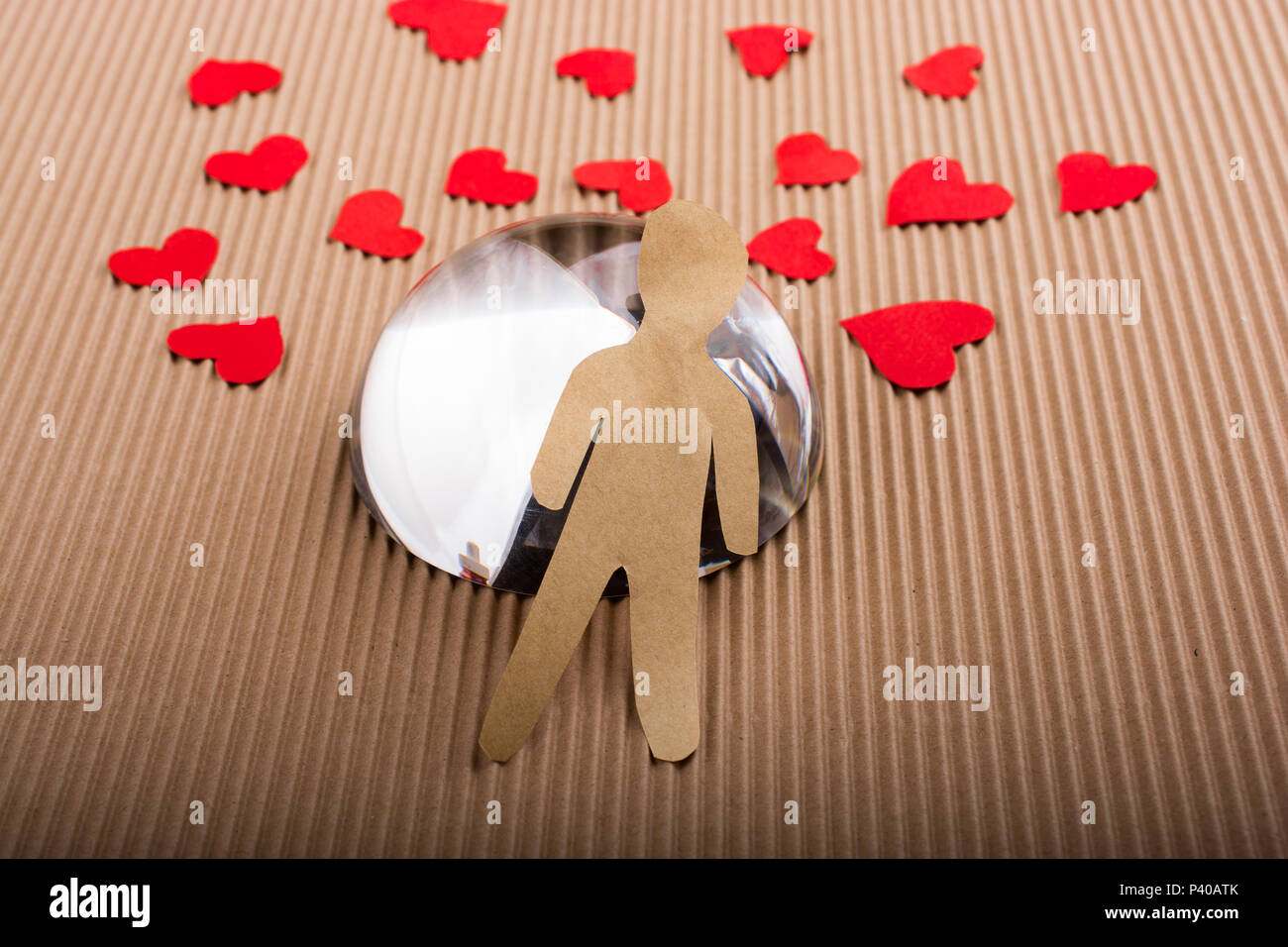 Man shape cut out of paper on paper background Stock Photo - Alamy