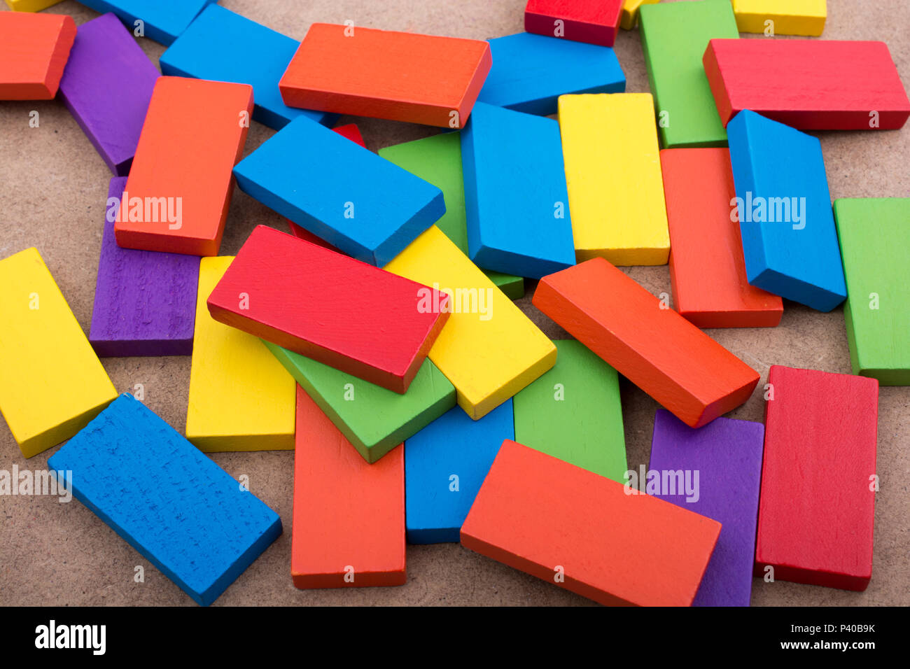 Wooden blocks of various color randomly scattered Stock Photo - Alamy