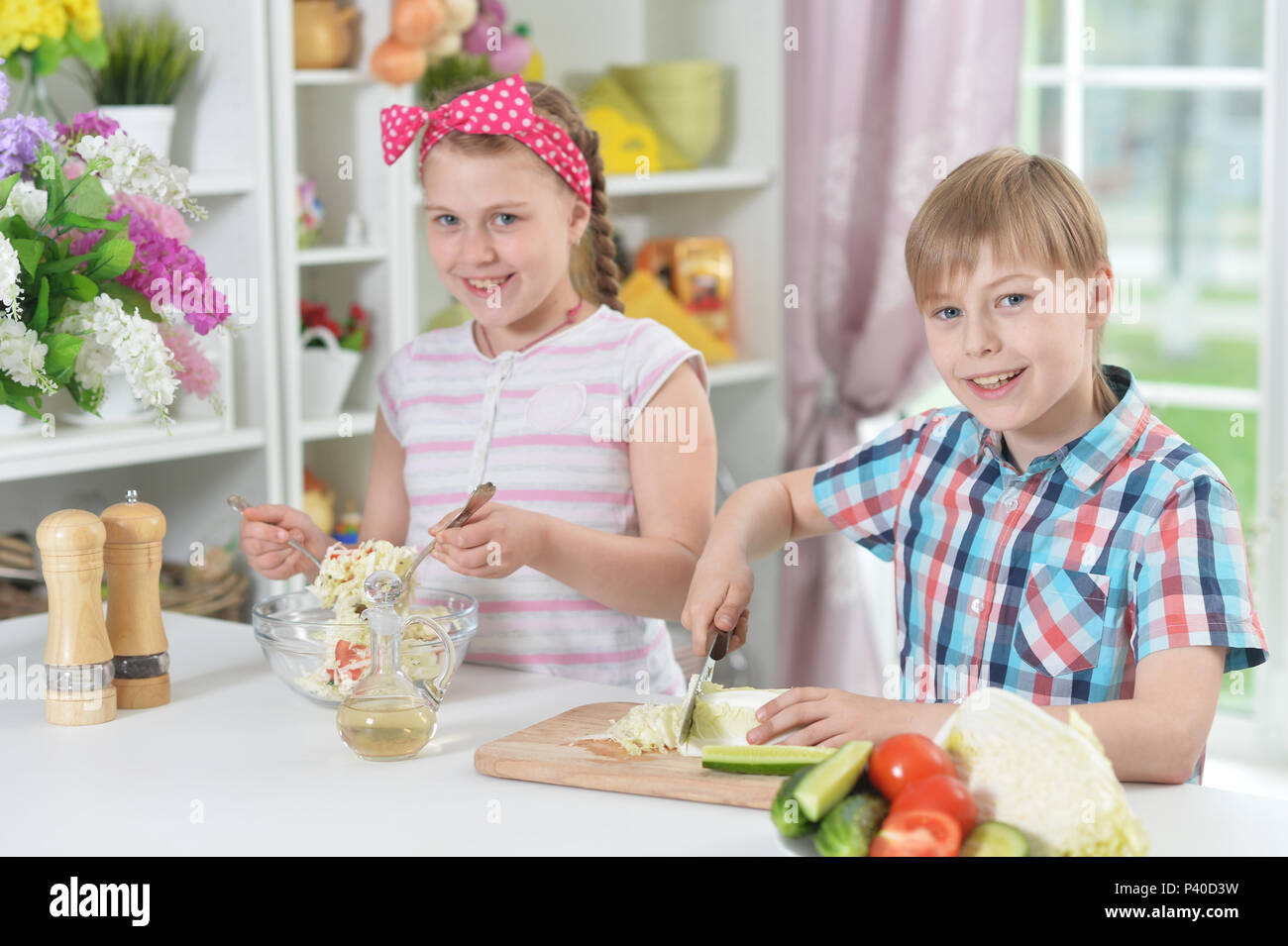 Cute brother and sister cooking together Stock Photo - Alamy