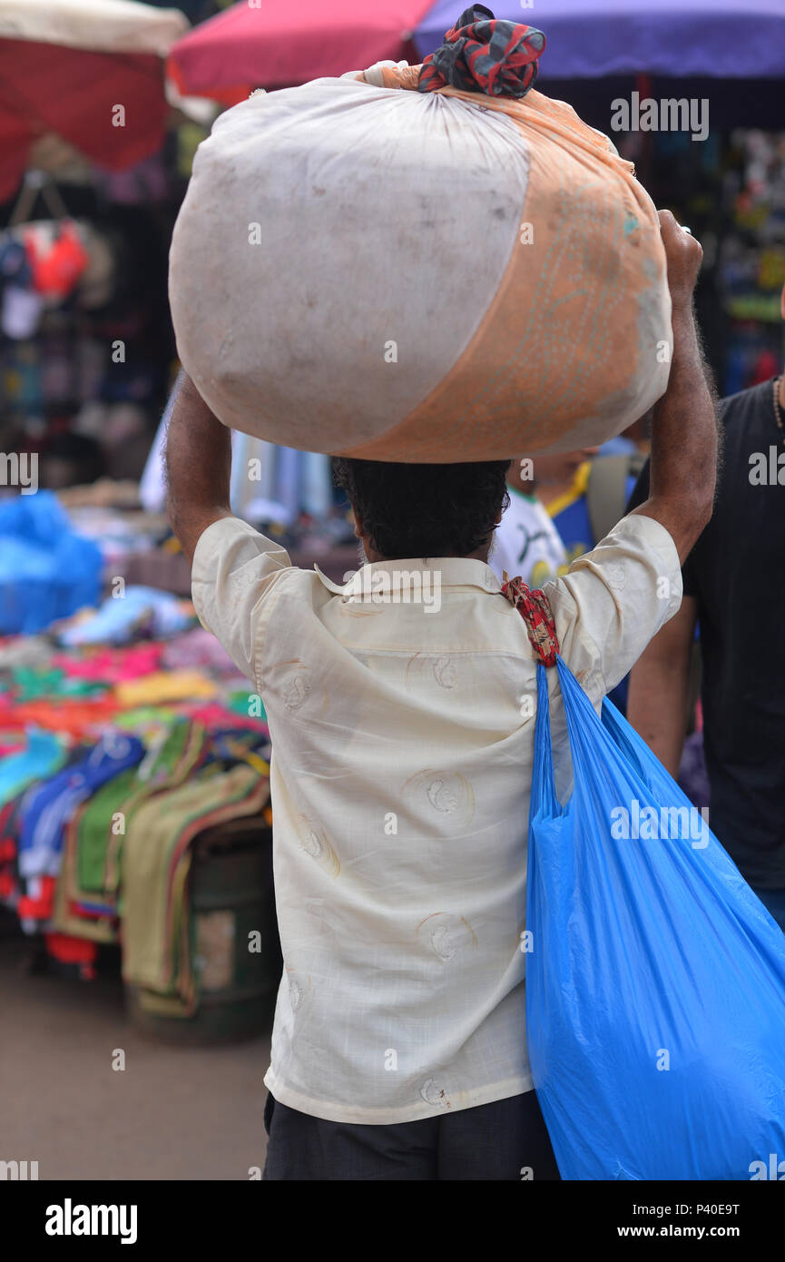 Indian man carrying many heavy hi-res stock photography and images - Alamy