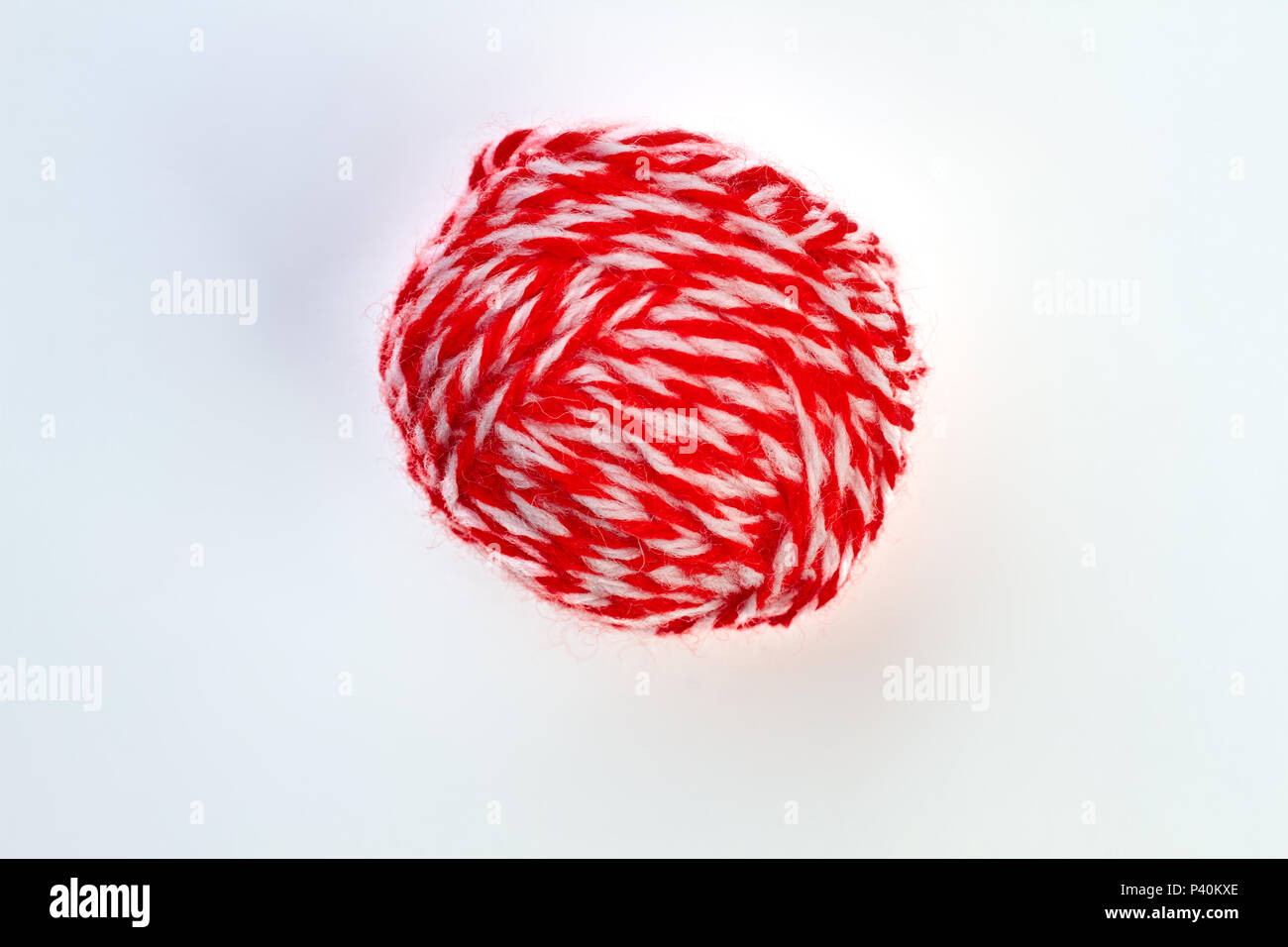 Ball of red yarn on white background. Ball of red and white yarn for ...