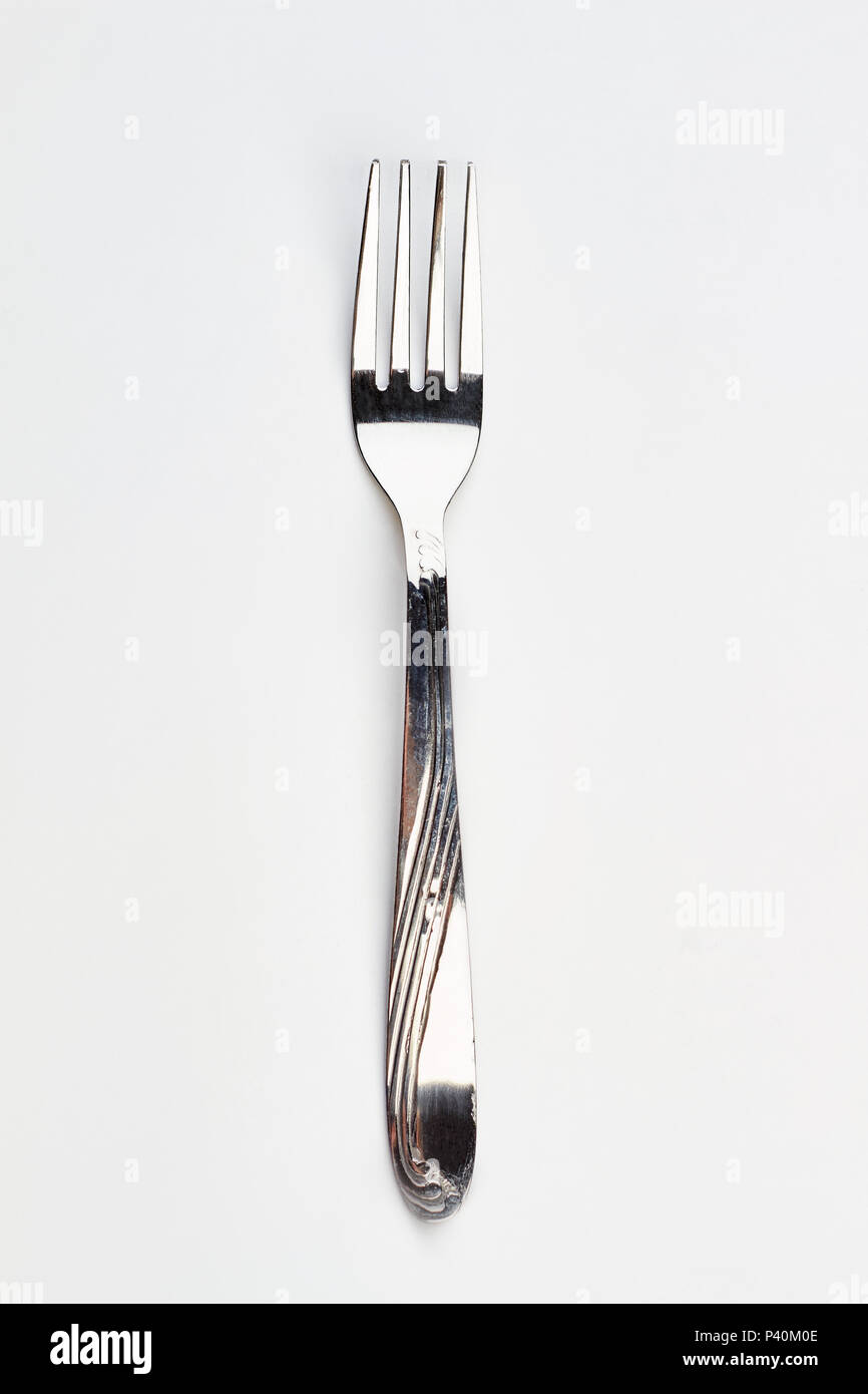 Silver fork isolated on white background. Steel metal table fork, top ...