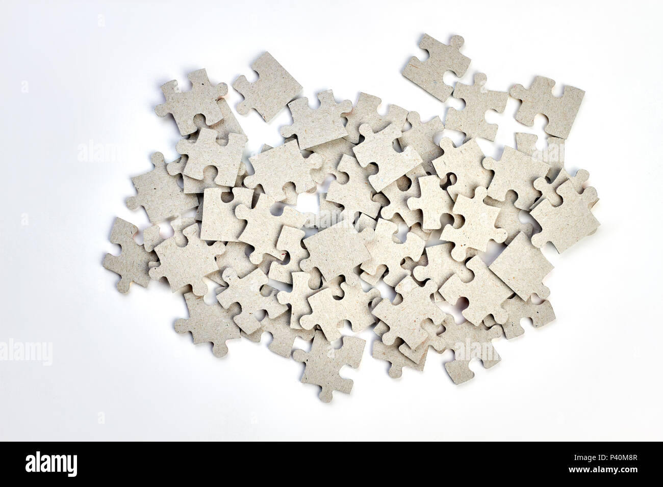 Heap of jigsaw puzzles on white background. Pile of uncompleted puzzles ...