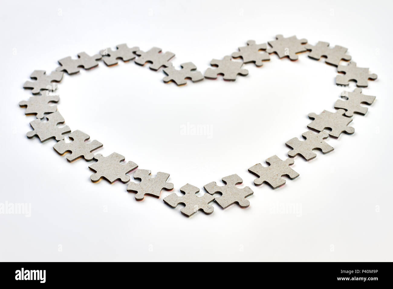 Shape of heart from puzzle elements. Jigsaw puzzles forming heart shape ...