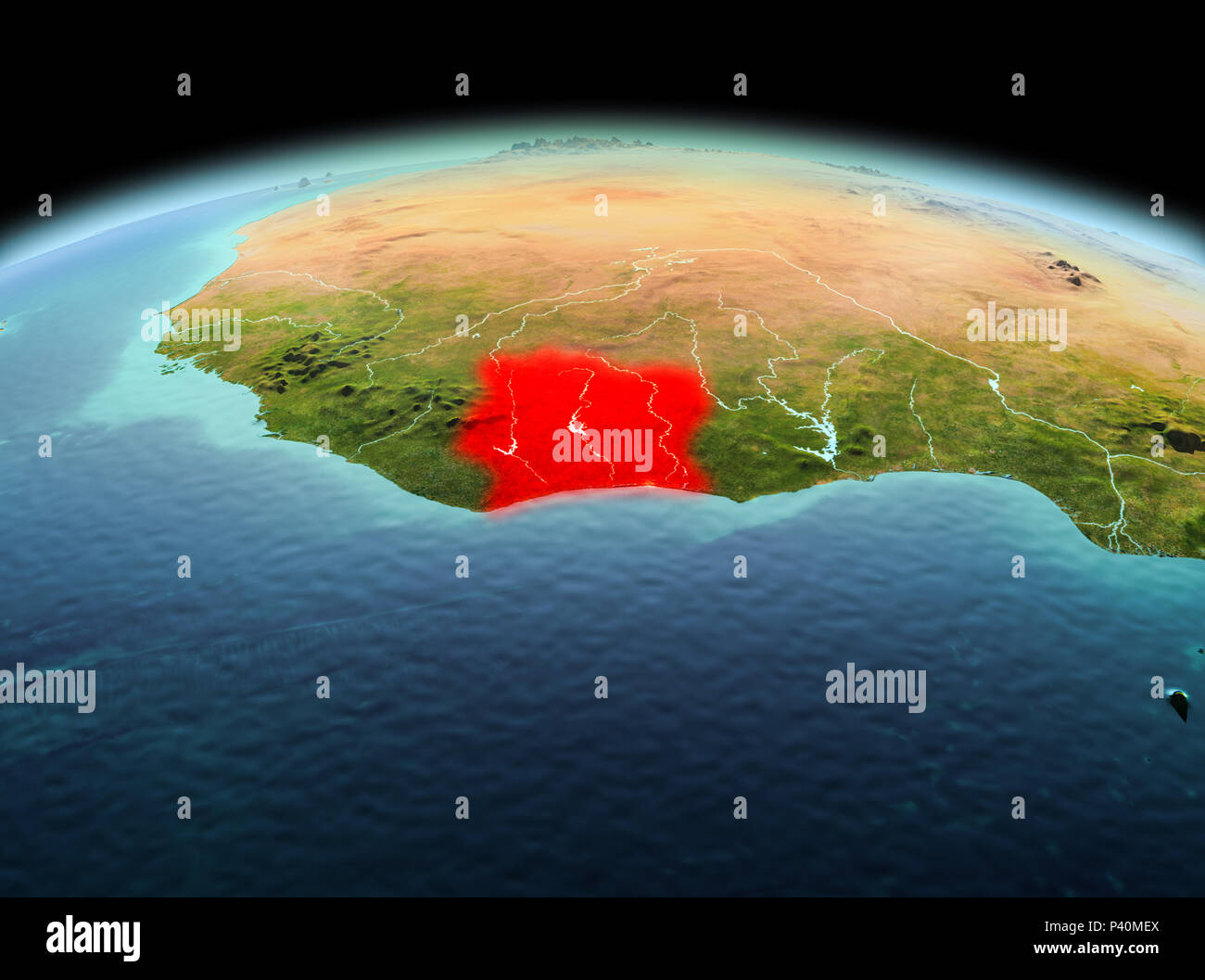 Morning above Ivory Coast highlighted in red on model of planet Earth ...