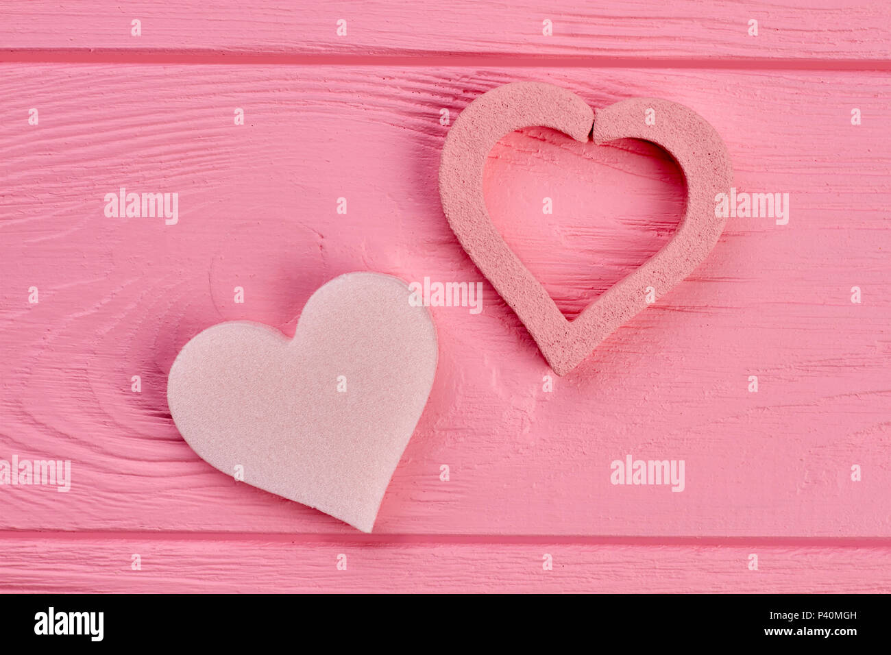 Pastel pink heart shape, top view. Decorative pumice heart of pink ...