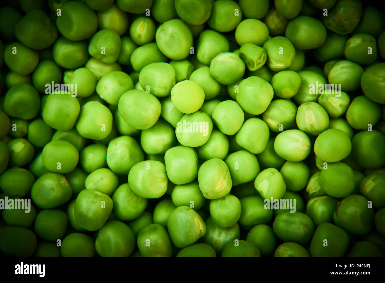 Fresh green peas background texture top view Stock Photo - Alamy