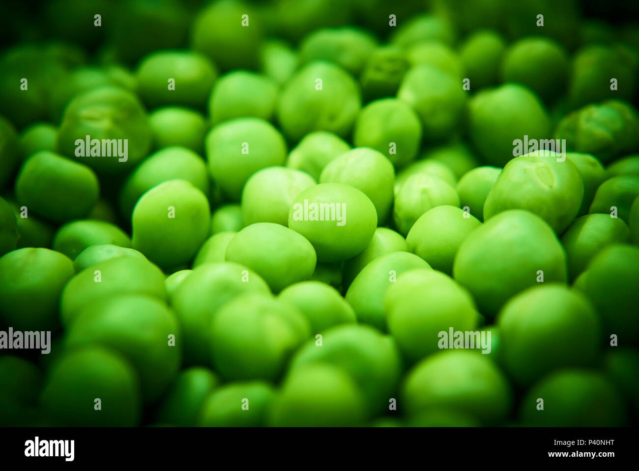Fresh green peas background texture top view Stock Photo - Alamy
