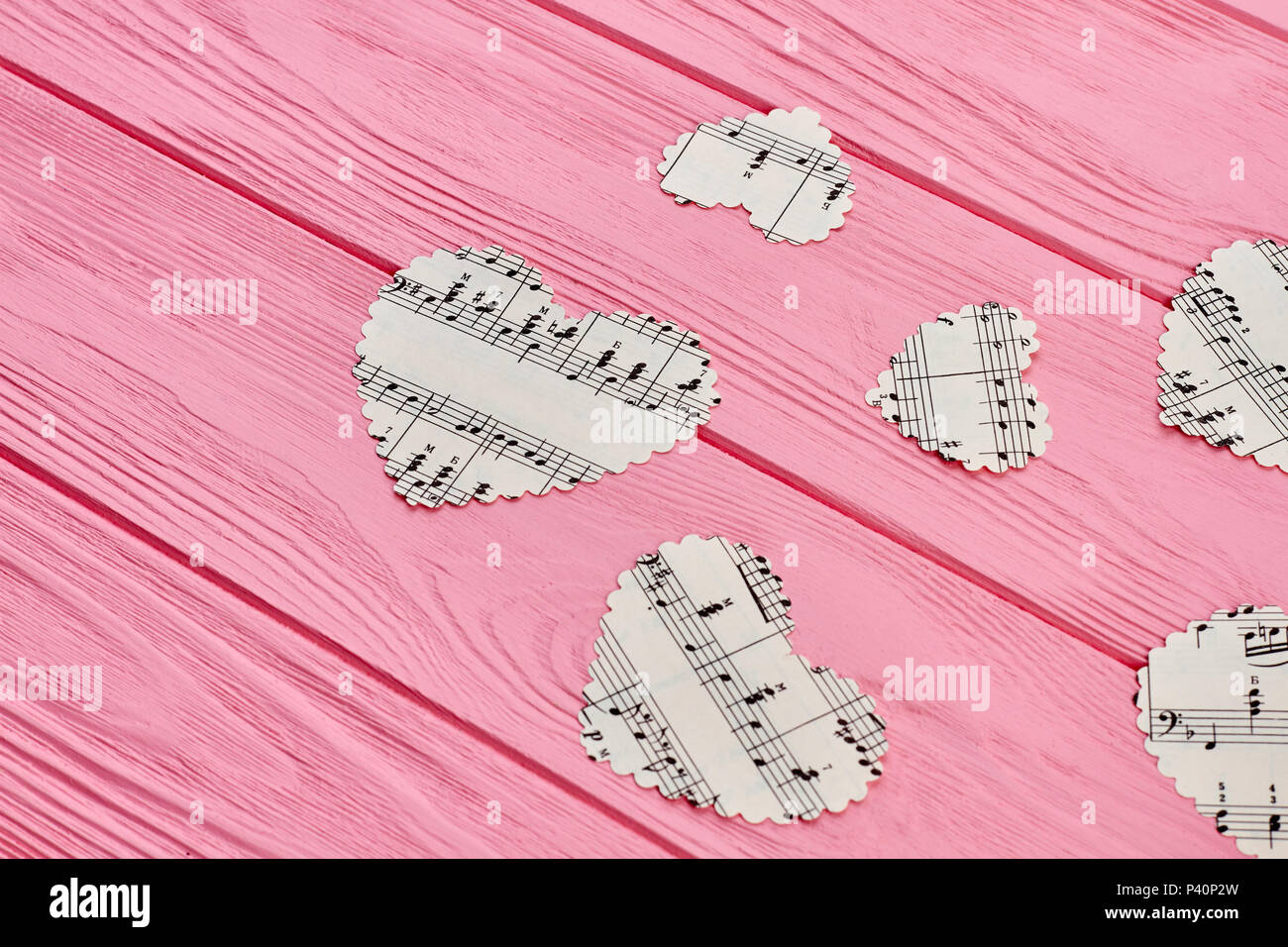 Music concept with paper hearts. Paper hearts with music notes on pink ...