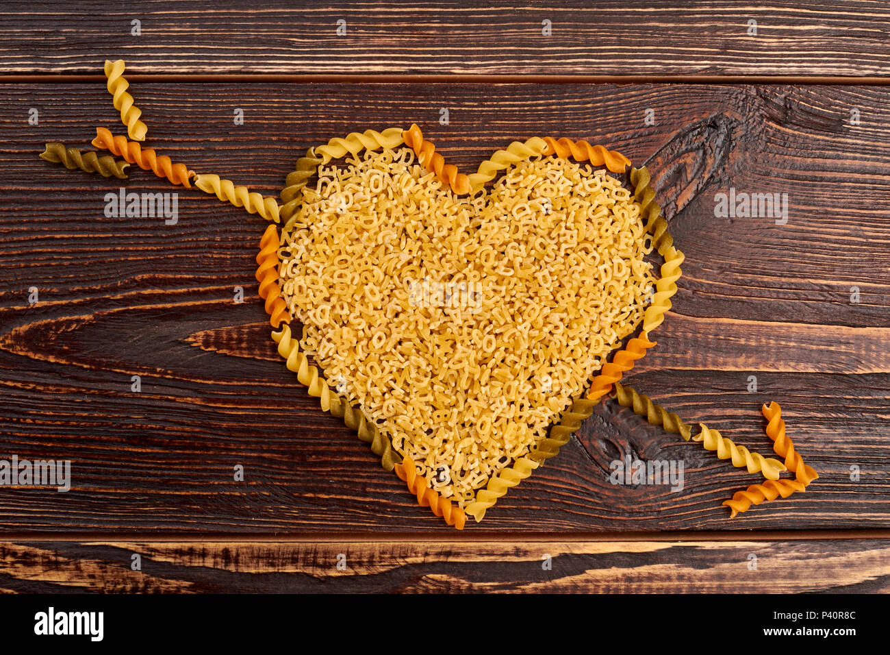 Heart shape and arrow from macaroni. Shape of heart and arrow from ...