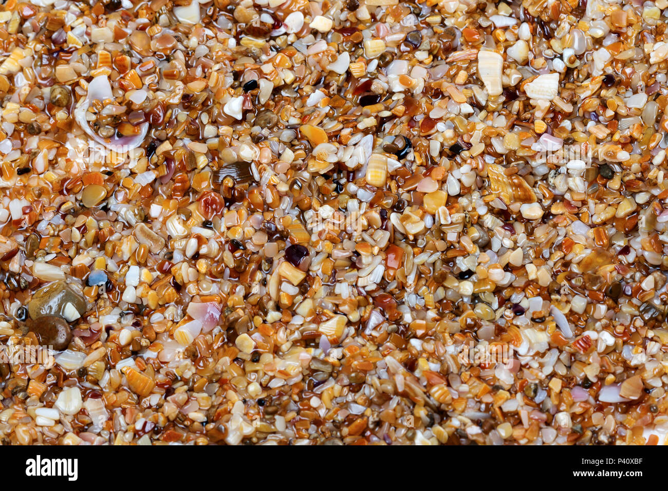Sunlight multicolor sand on beach in sun summer day. View from above ...
