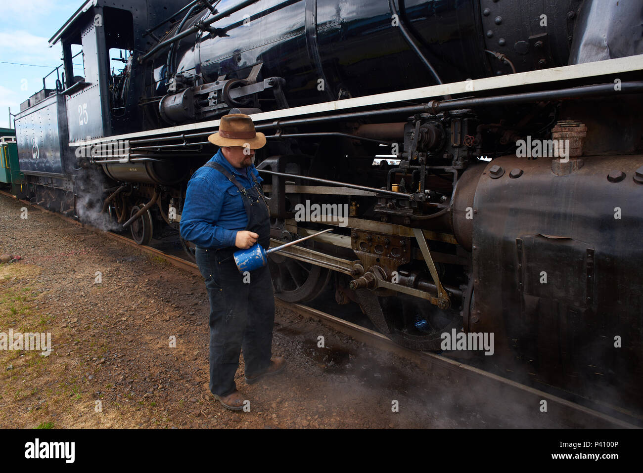 ROCKAWAY BEACH, OREGON-JUNE 15, 2018: An oiler oils the old steam ...