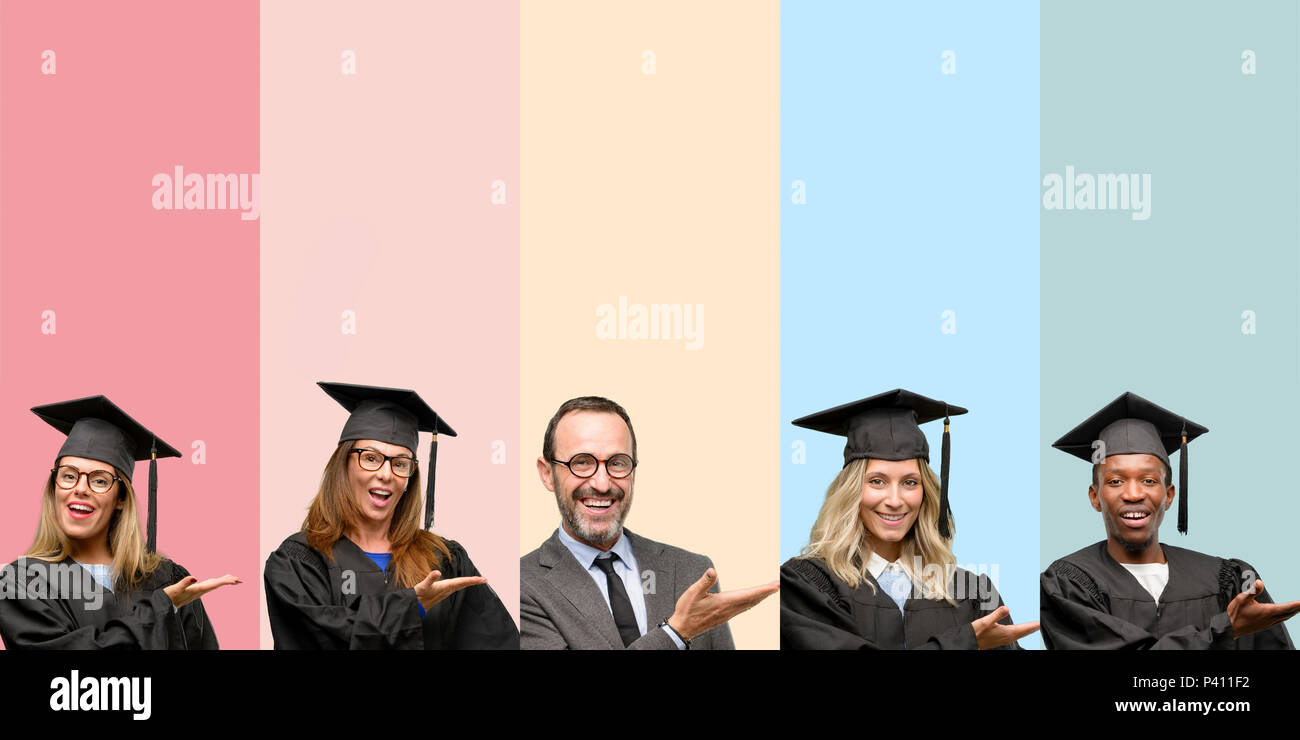 Senior teacher with his graduate students holding something in empty ...