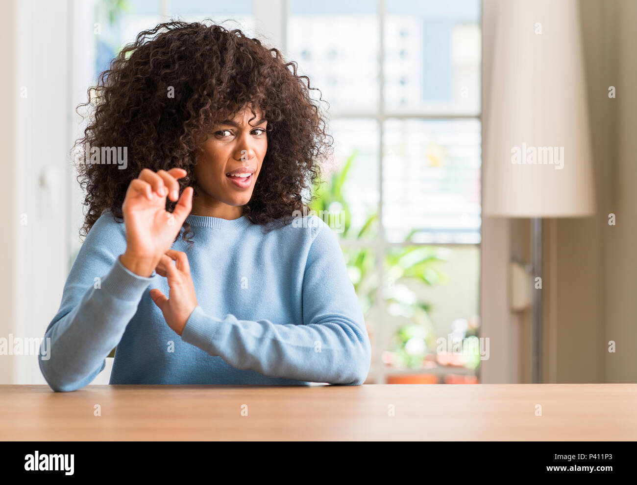 African american woman at home disgusted expression, displeased and ...