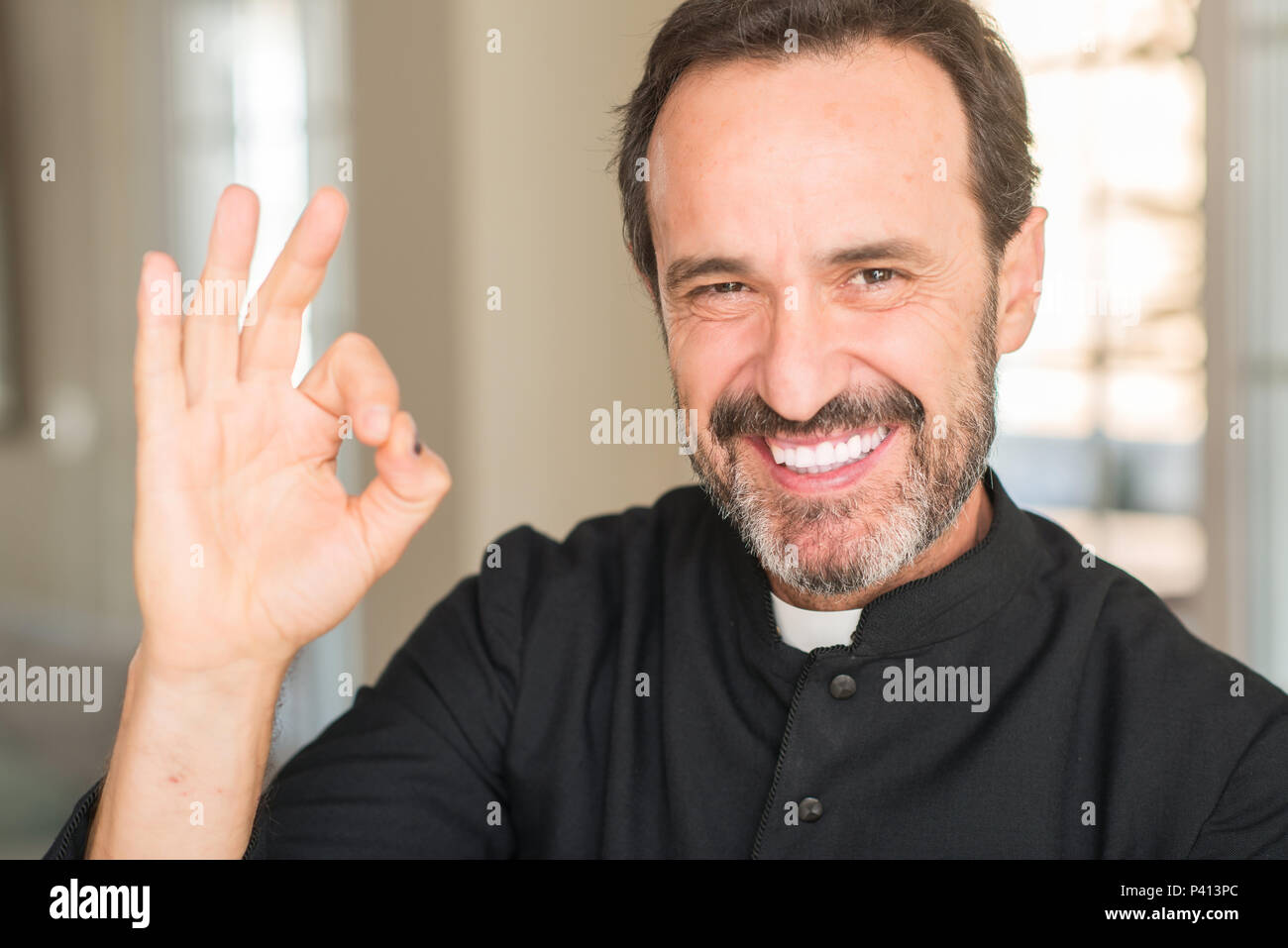 Christian priest man doing ok sign with fingers, excellent symbol Stock ...