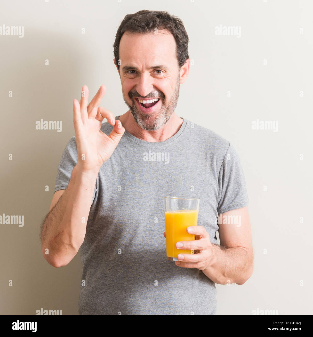 Man drinking orange juice in hi-res stock photography and images - Alamy