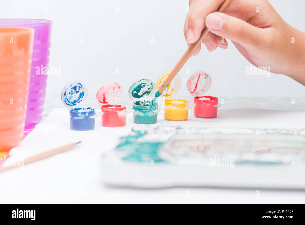 Children learn coloring and painting in classroom Stock Photo - Alamy