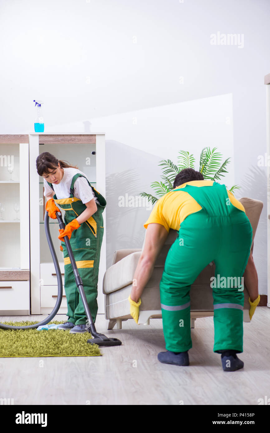 Cleaning professional contractors working at house Stock Photo - Alamy