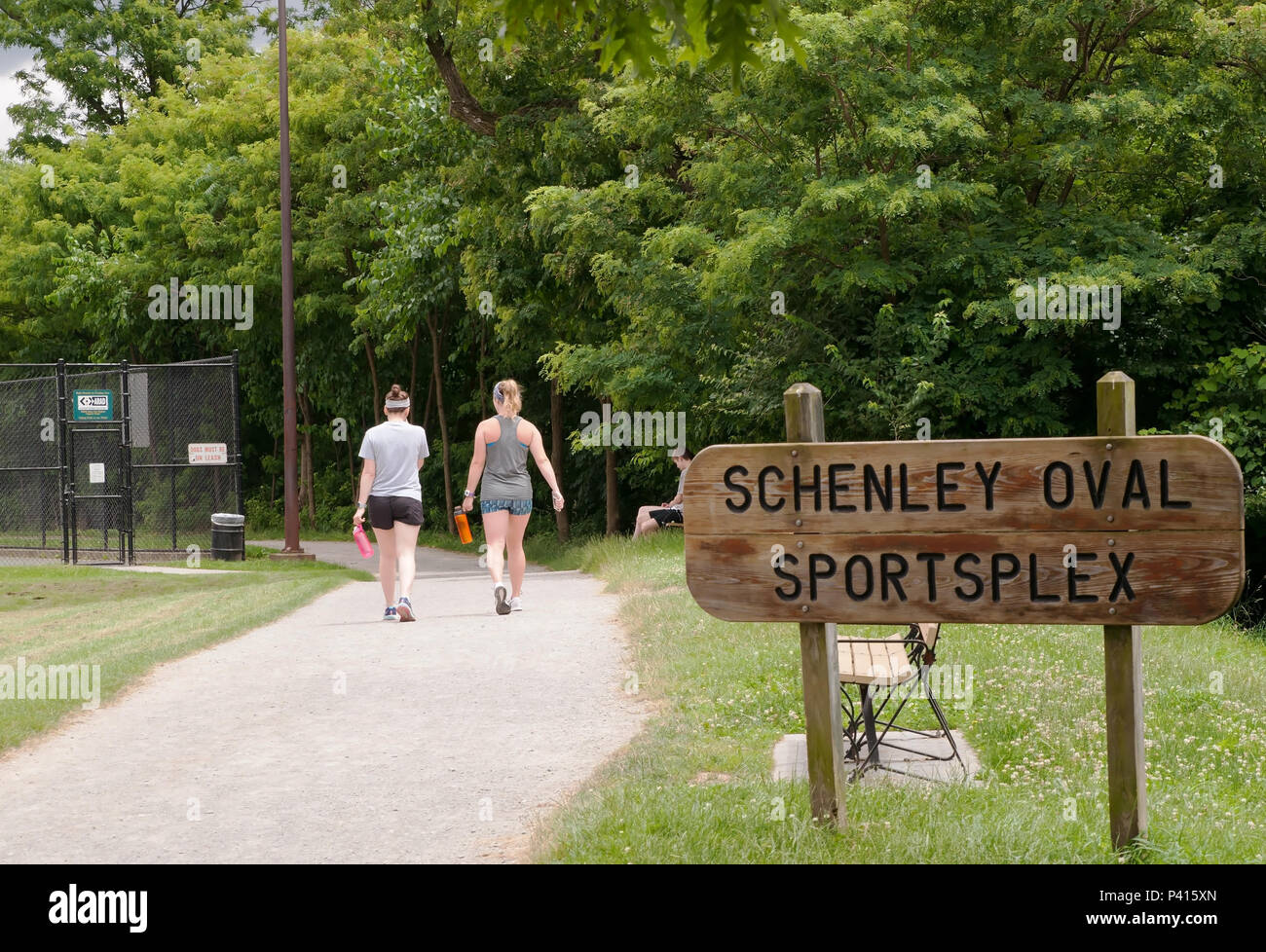 Two girls at the sign for the Schenley Oval Sports Complex in Schenley ...