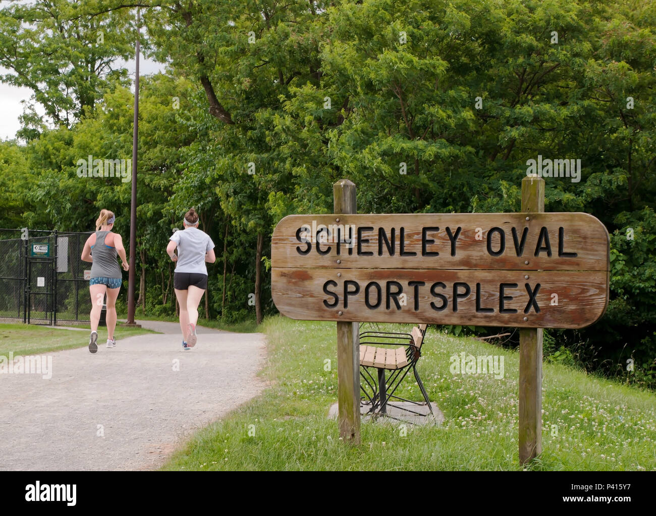 Two girls at the sign for the Schenley Oval Sports Complex in Schenley ...