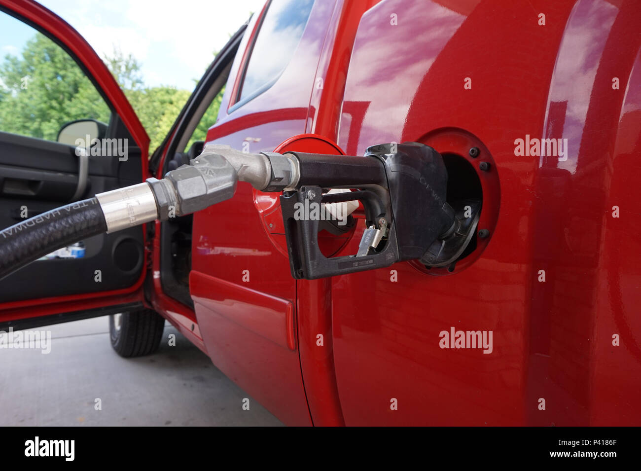 A red truck being fueled up at a Ingles Gas Express Stock Photo - Alamy