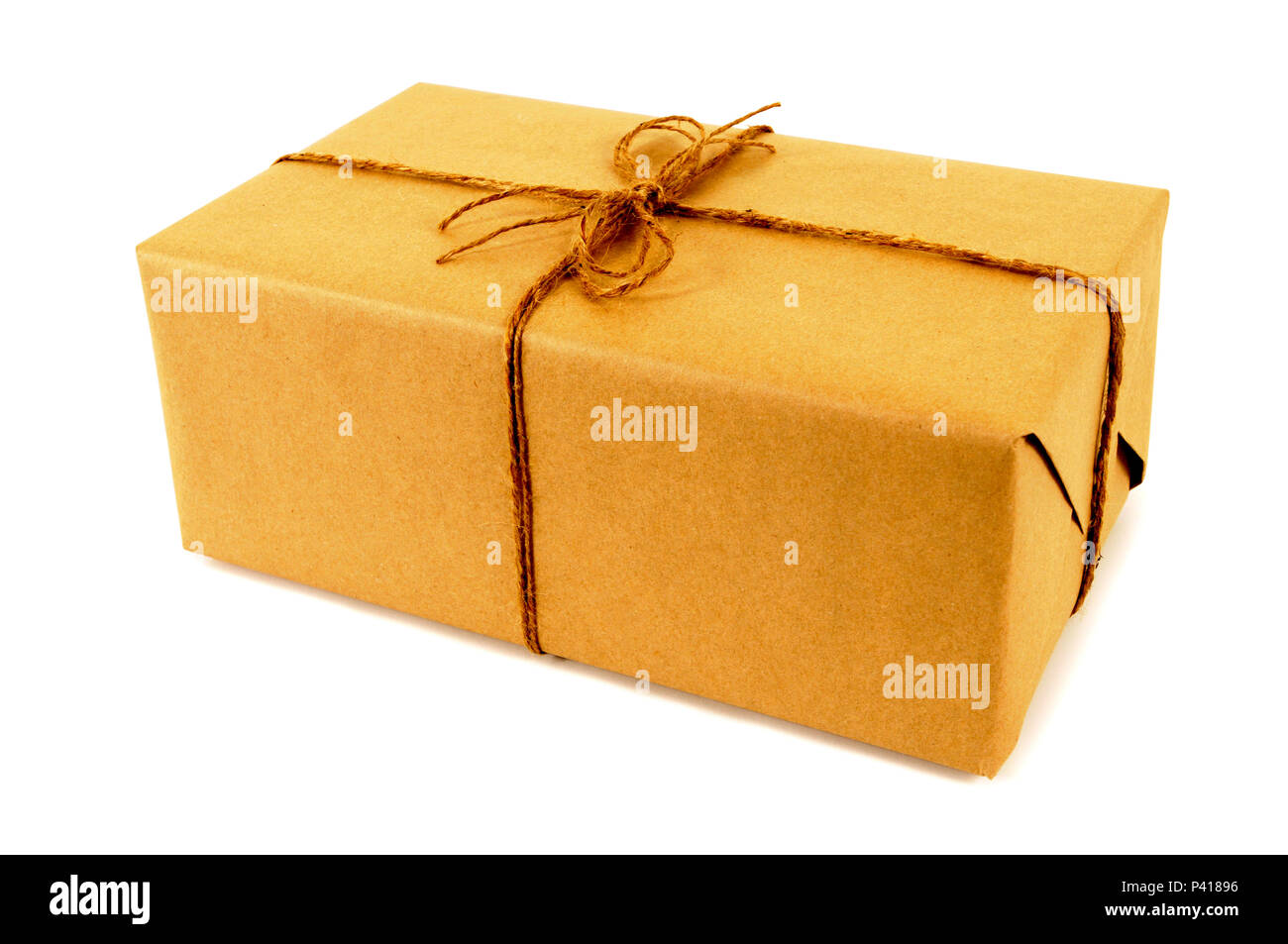 Brown paper package tied with string Stock Photo - Alamy