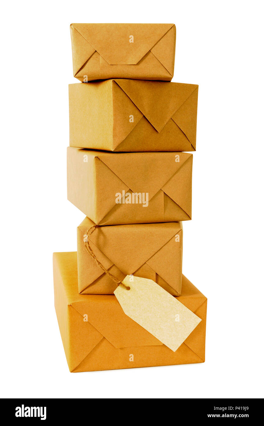Tall stack of brown paper packages with label Stock Photo - Alamy