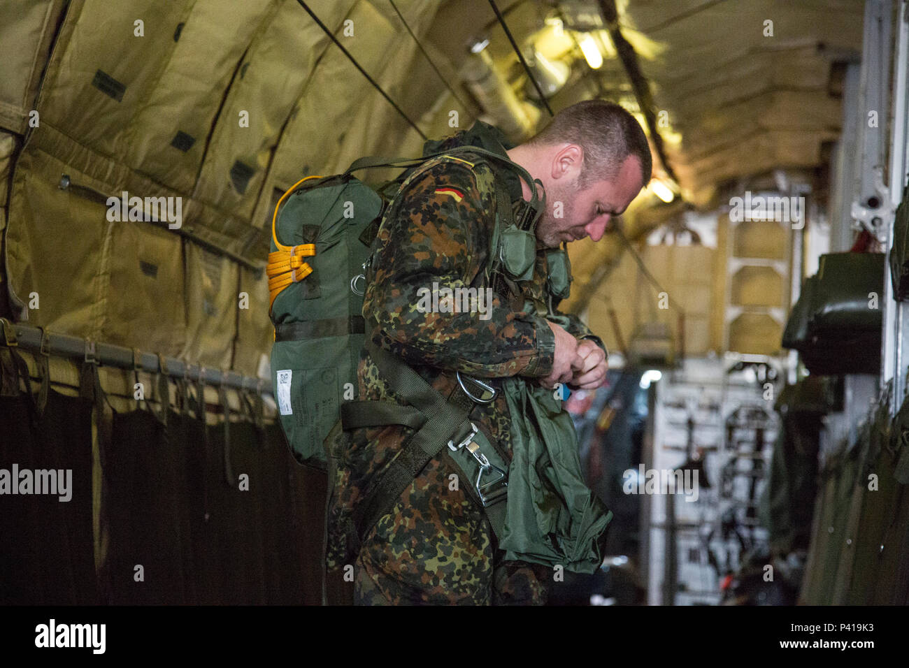A German jumpmaster prepares for airborne operations from a C-160 ...