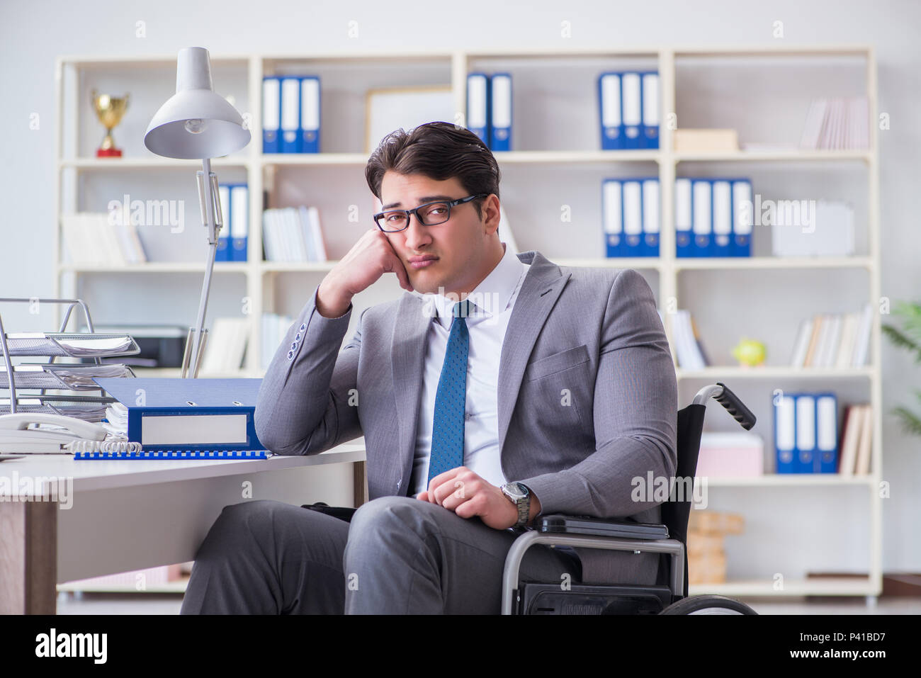 Disabled businessman working in the office Stock Photo - Alamy