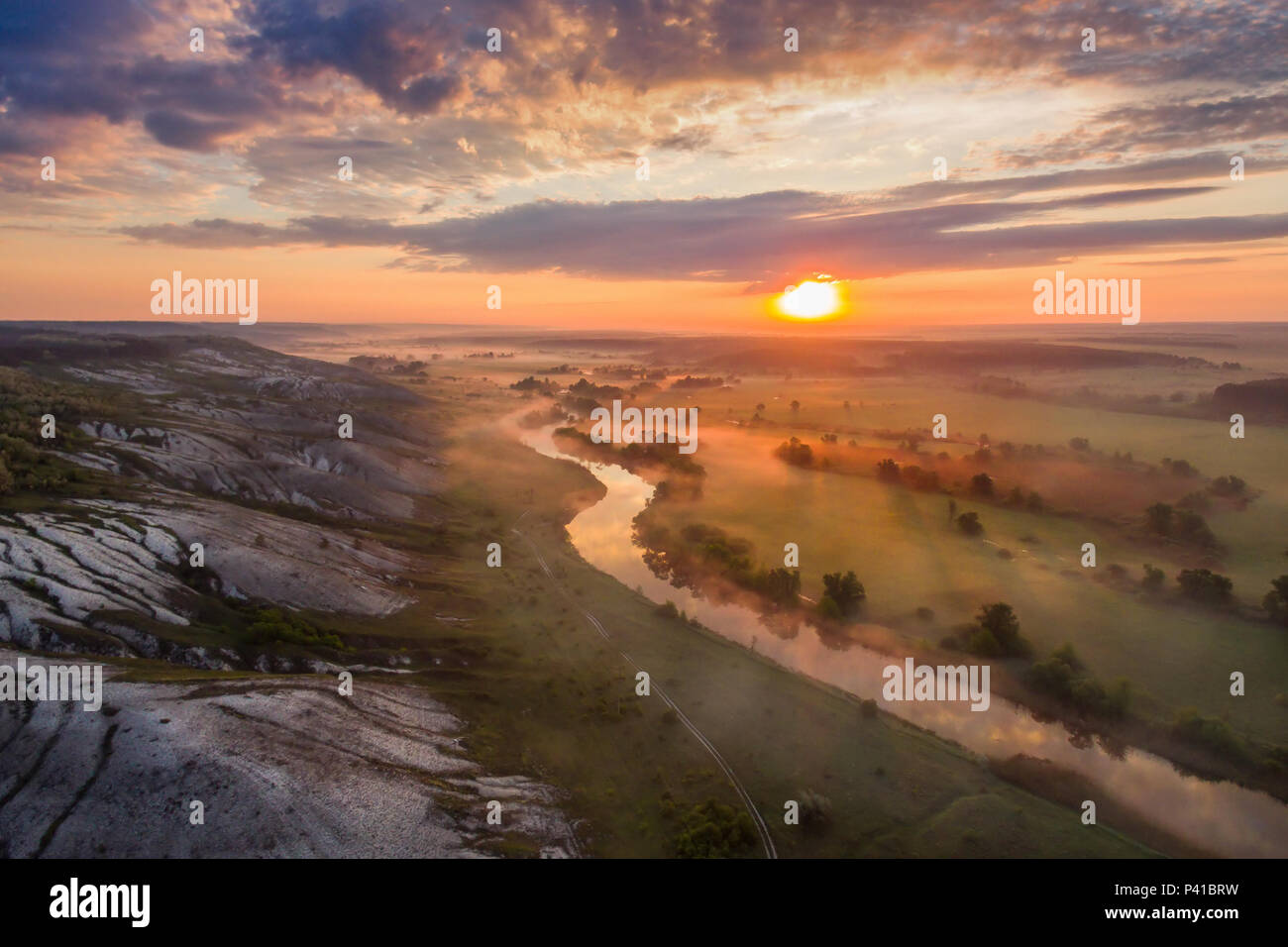 Landscape on sunrise with fog, river and chalky hills, make from drone ...
