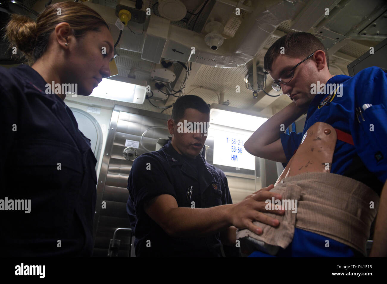 PHILIPPINE SEA (June 1, 2016) – Sailors practice medical training ...