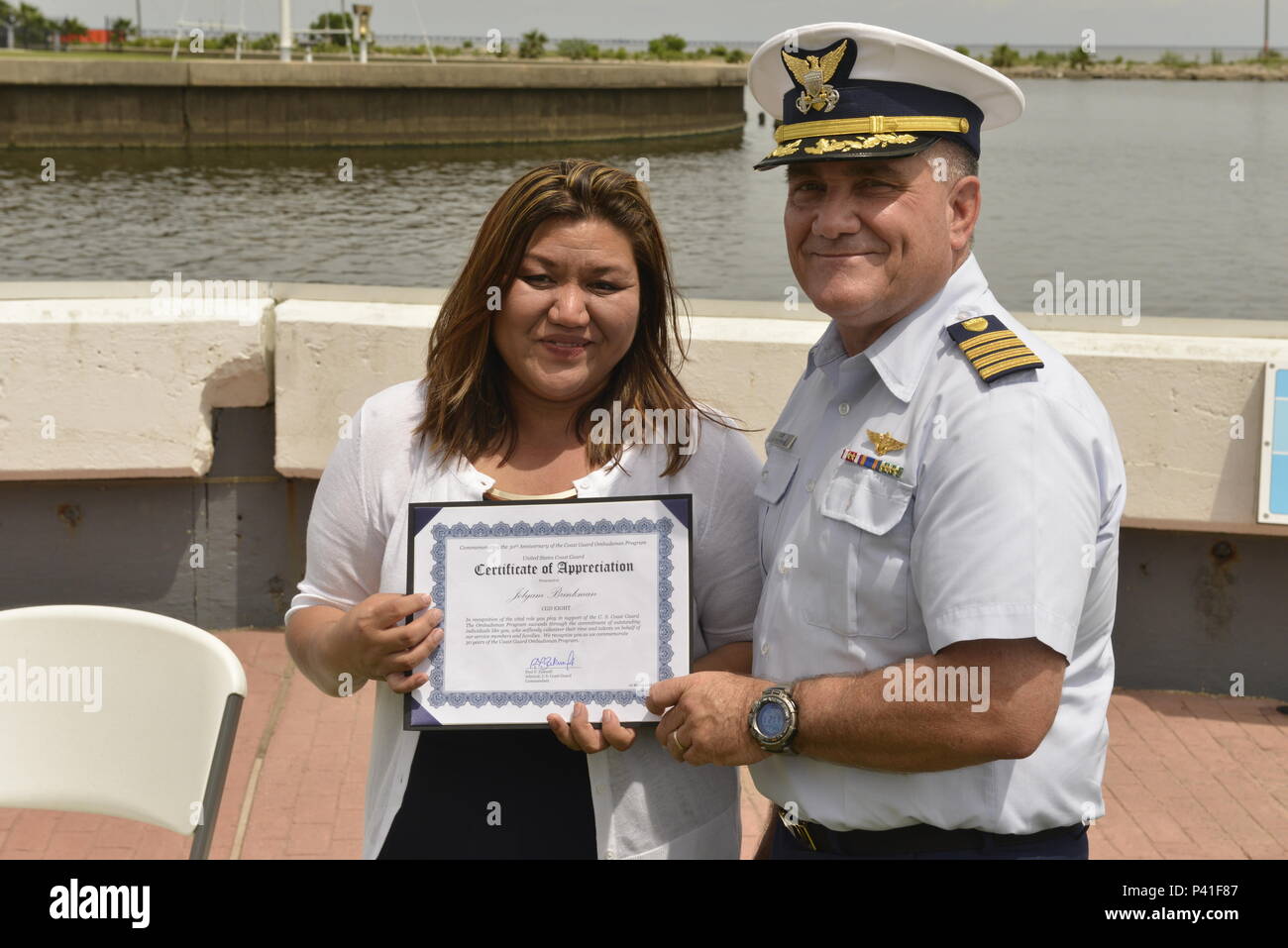 Jolyam Brinkman, 8th Coast Guard District Ombudsman, receiving a ...