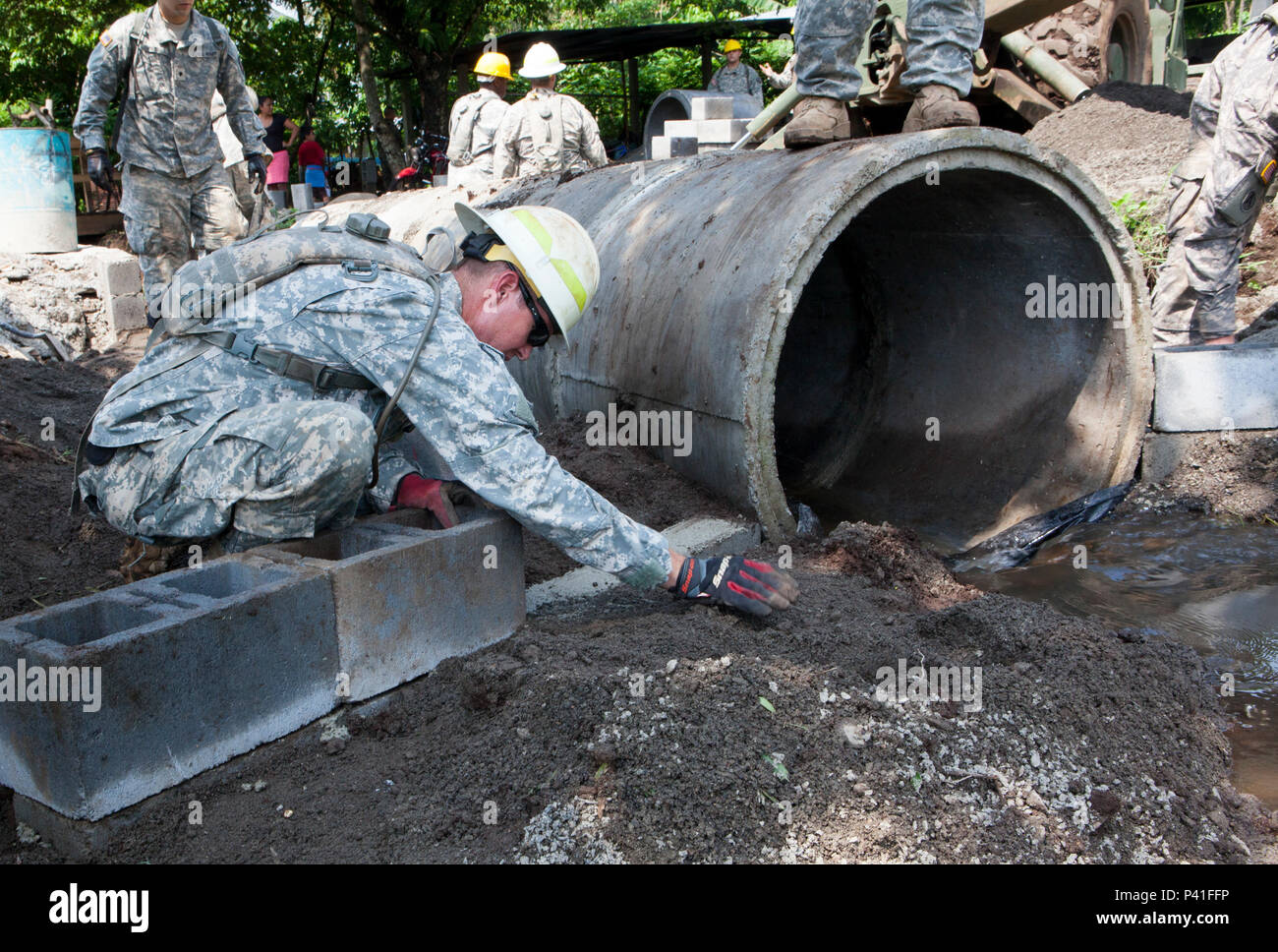 U.S. Soldiers with the 1021st Engineering Company install a 40-inch ...