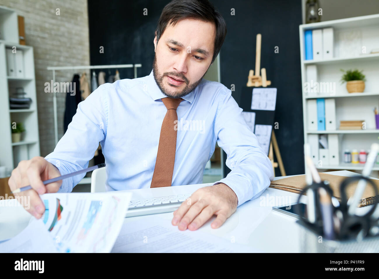 Corporate employee working business papers hi-res stock photography and ...