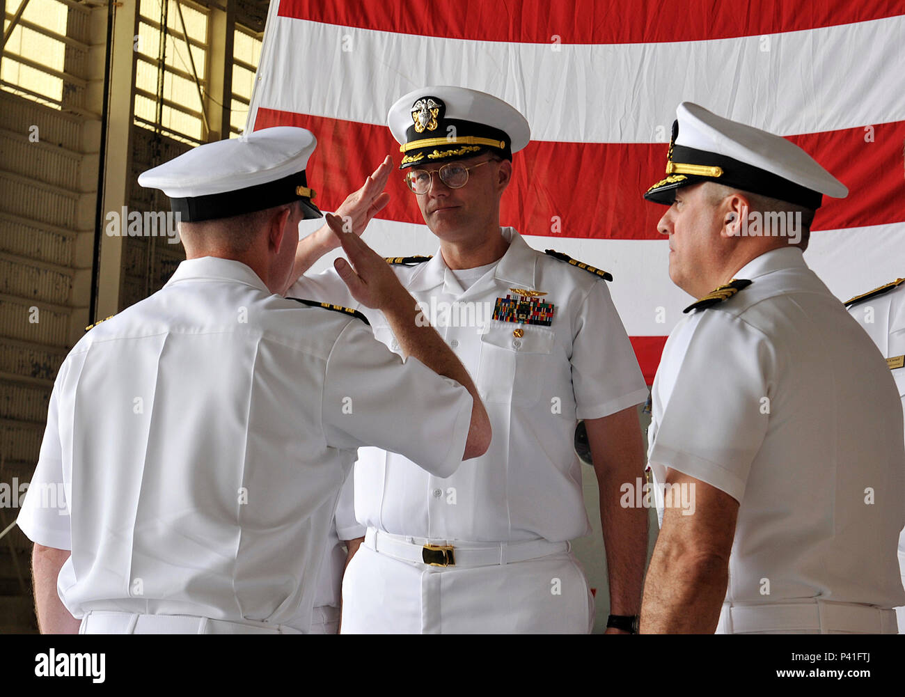 U.S. Navy Cmdr. Aaron Shoemaker, Patrol Squadron Forty commander (left ...