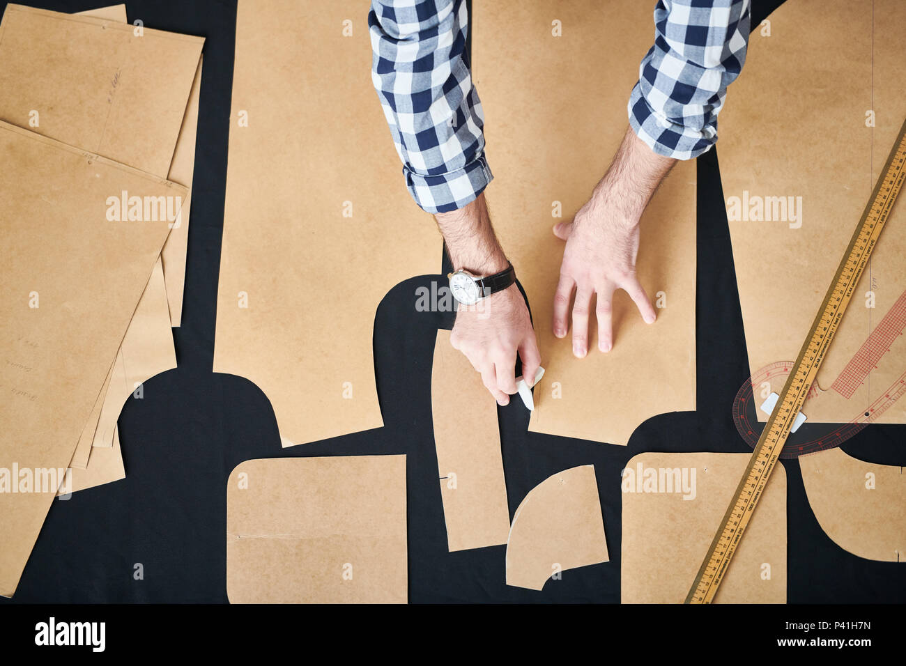 Tailor cutting pattern hi-res stock photography and images - Alamy