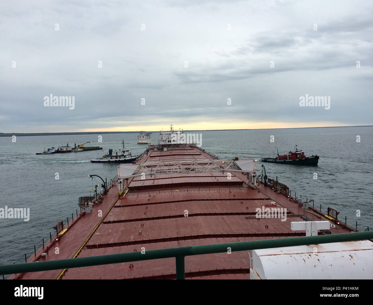 The motor vessel Roger Blough holds steady with assistance of support ...