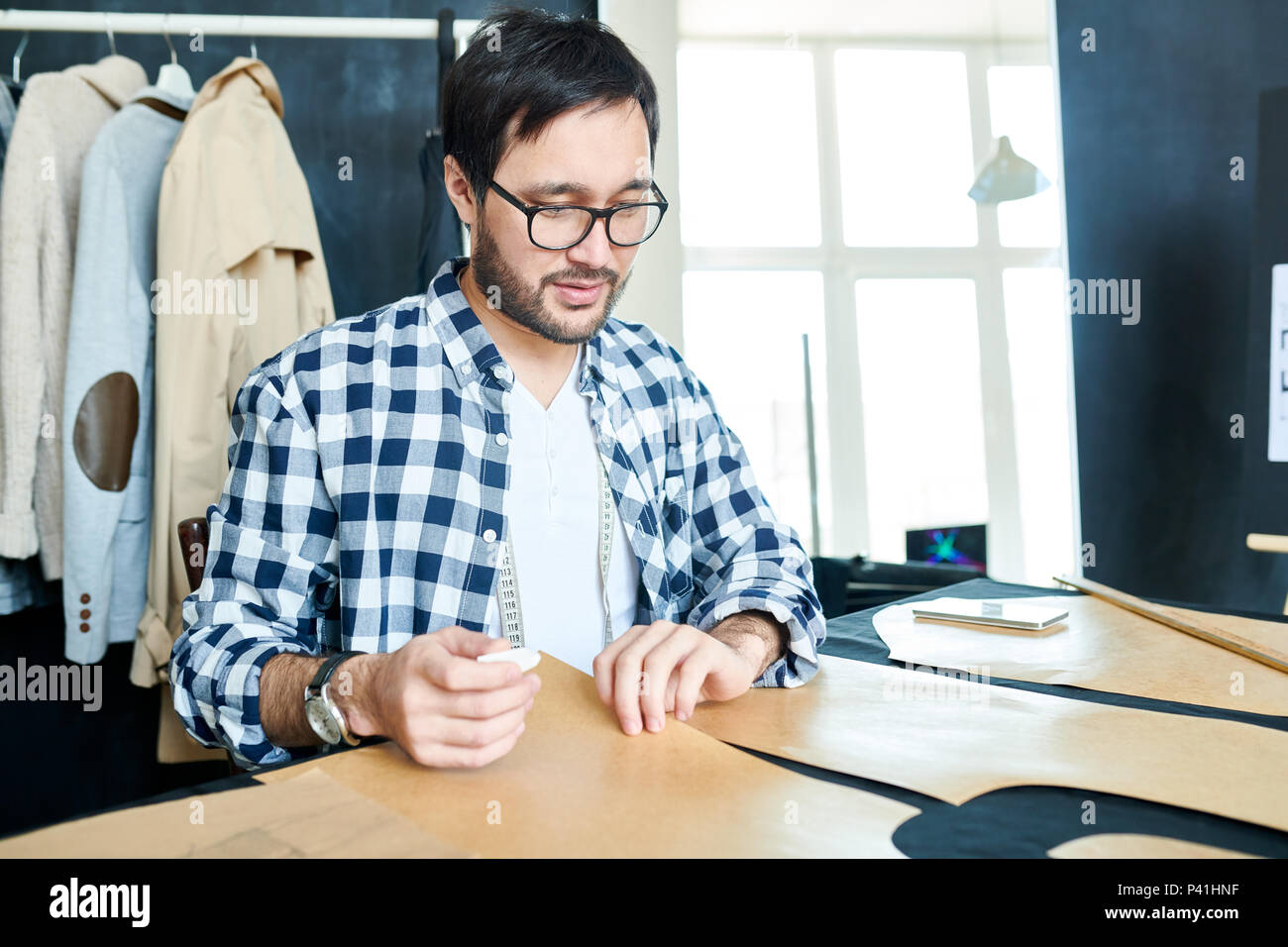 Creative man designing modern clothes Stock Photo - Alamy