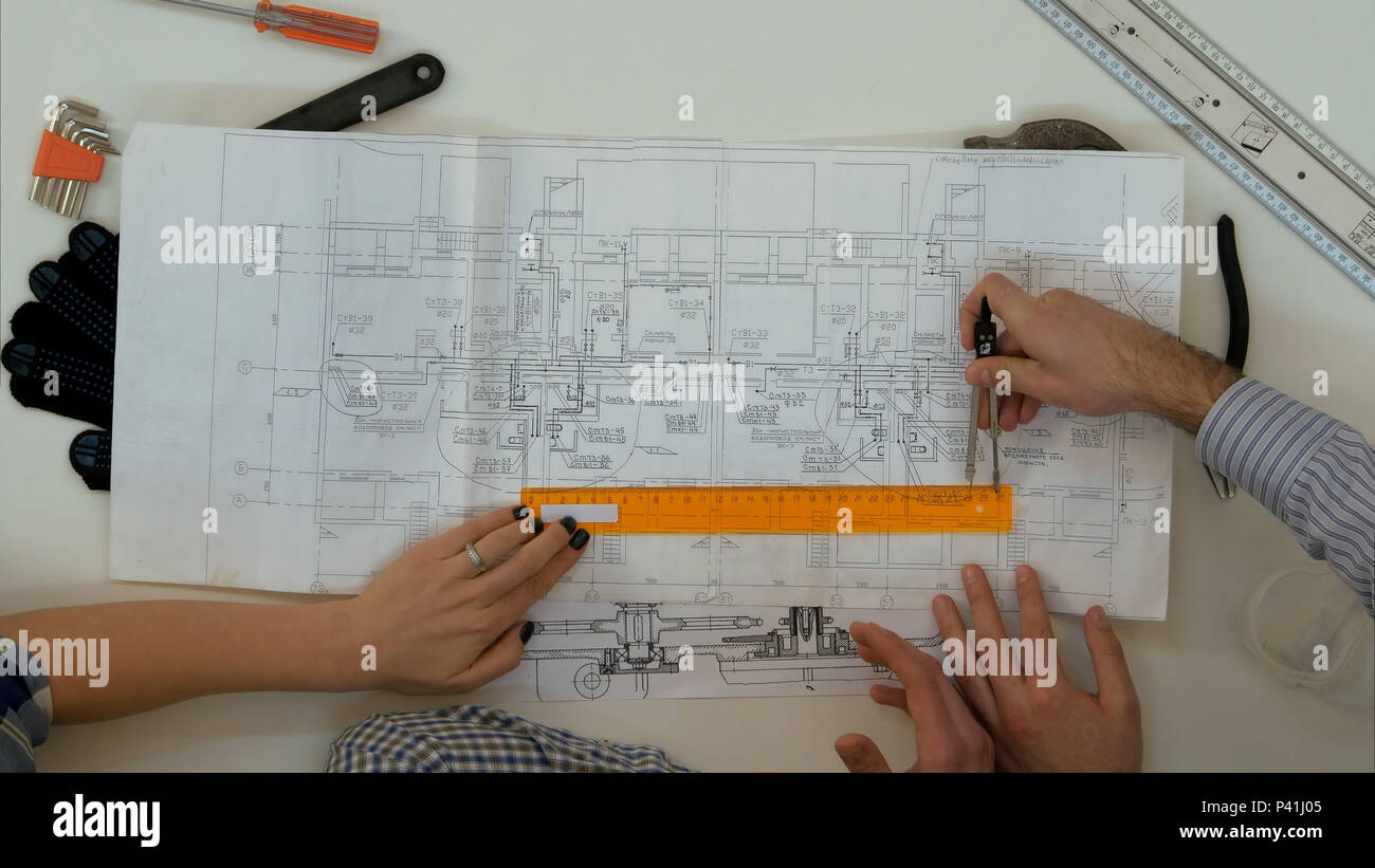 Male designer checking measurements hi-res stock photography and images ...
