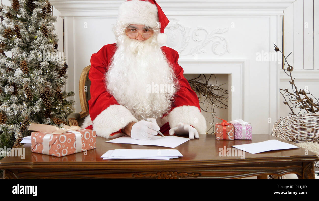 Santa Claus thinking what to write in his Christmas letter Stock Photo ...