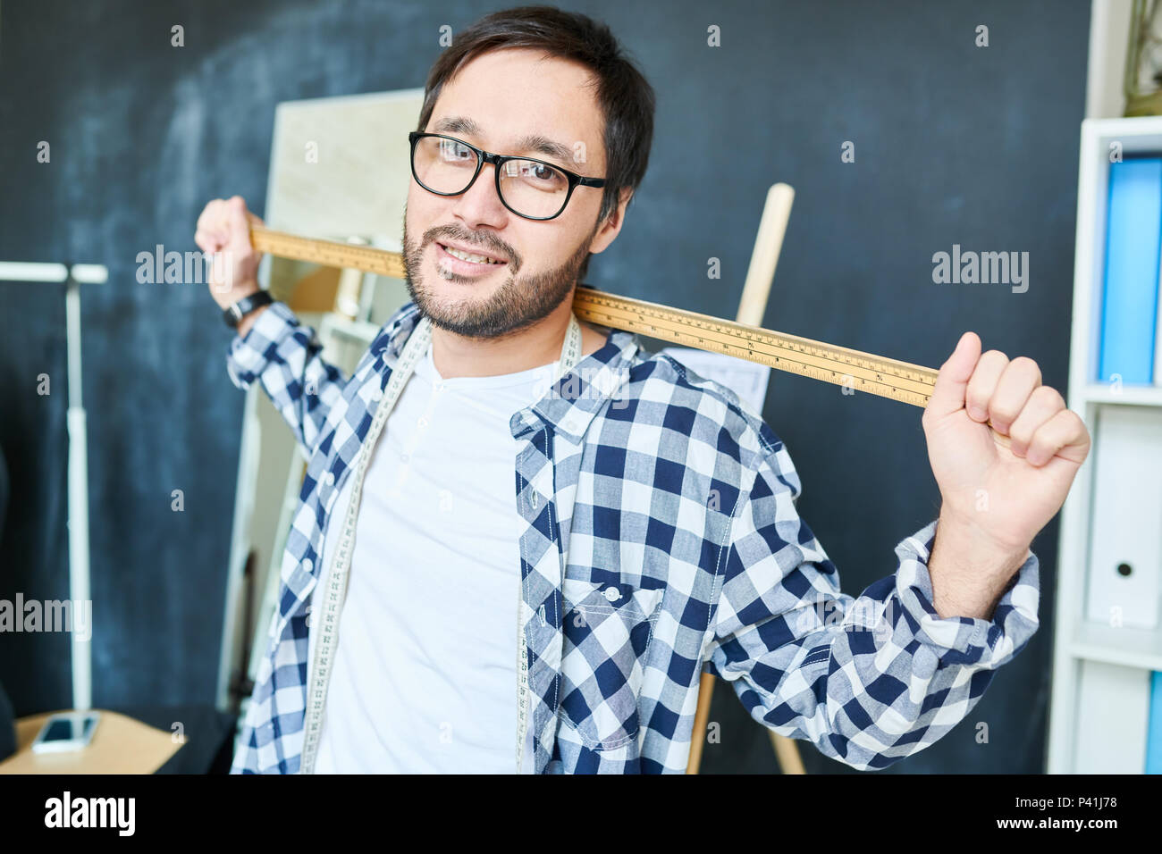 Man with ruler hi-res stock photography and images - Alamy