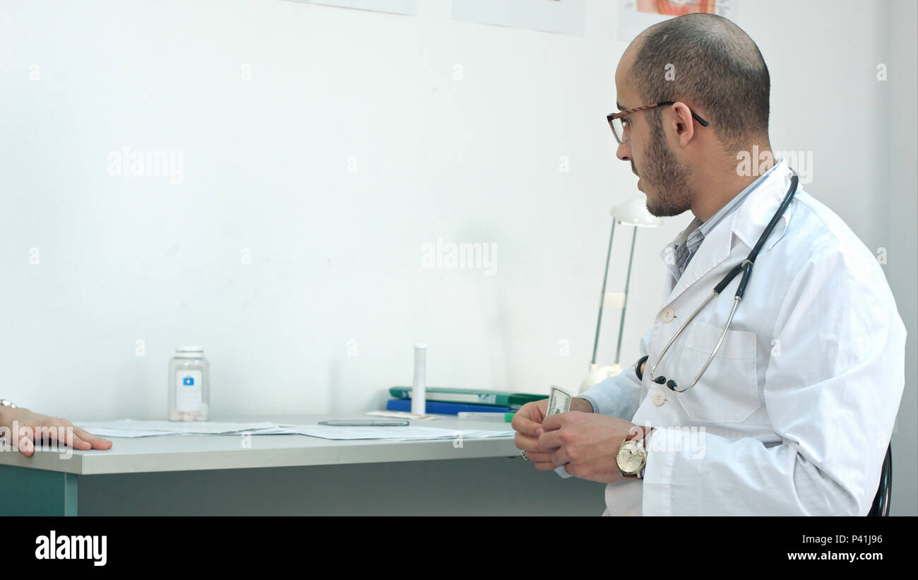 Female patient paying money for pills prescribed by doctor Stock Photo ...